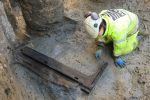 Archaeologists uncover complete Roman funerary bed in London